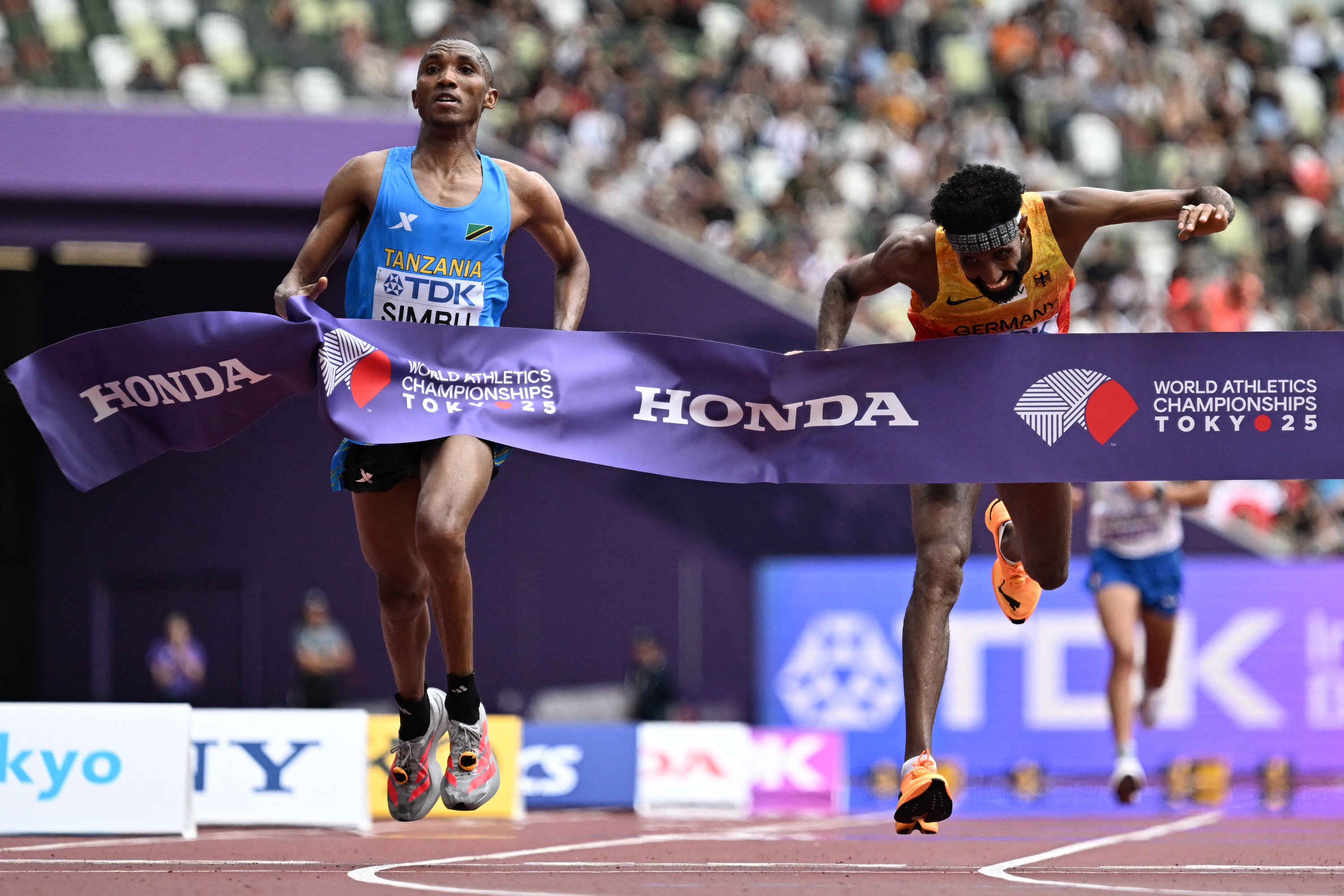 First-ever Tanzanian gold as Simbu dips past Petros in world marathon